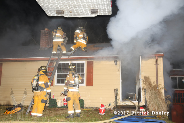 firefighters vent roof at night | FireScenes.Net